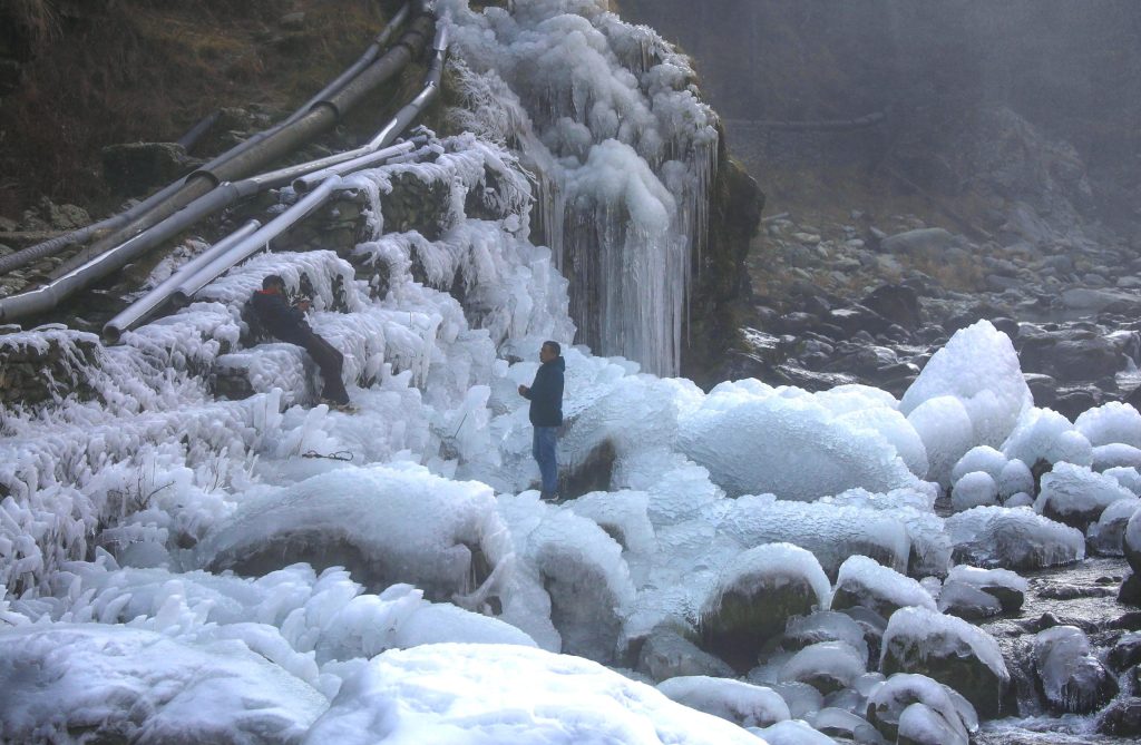 A frozen waterfall is seen in the Drung area of north Kashmir’s ...